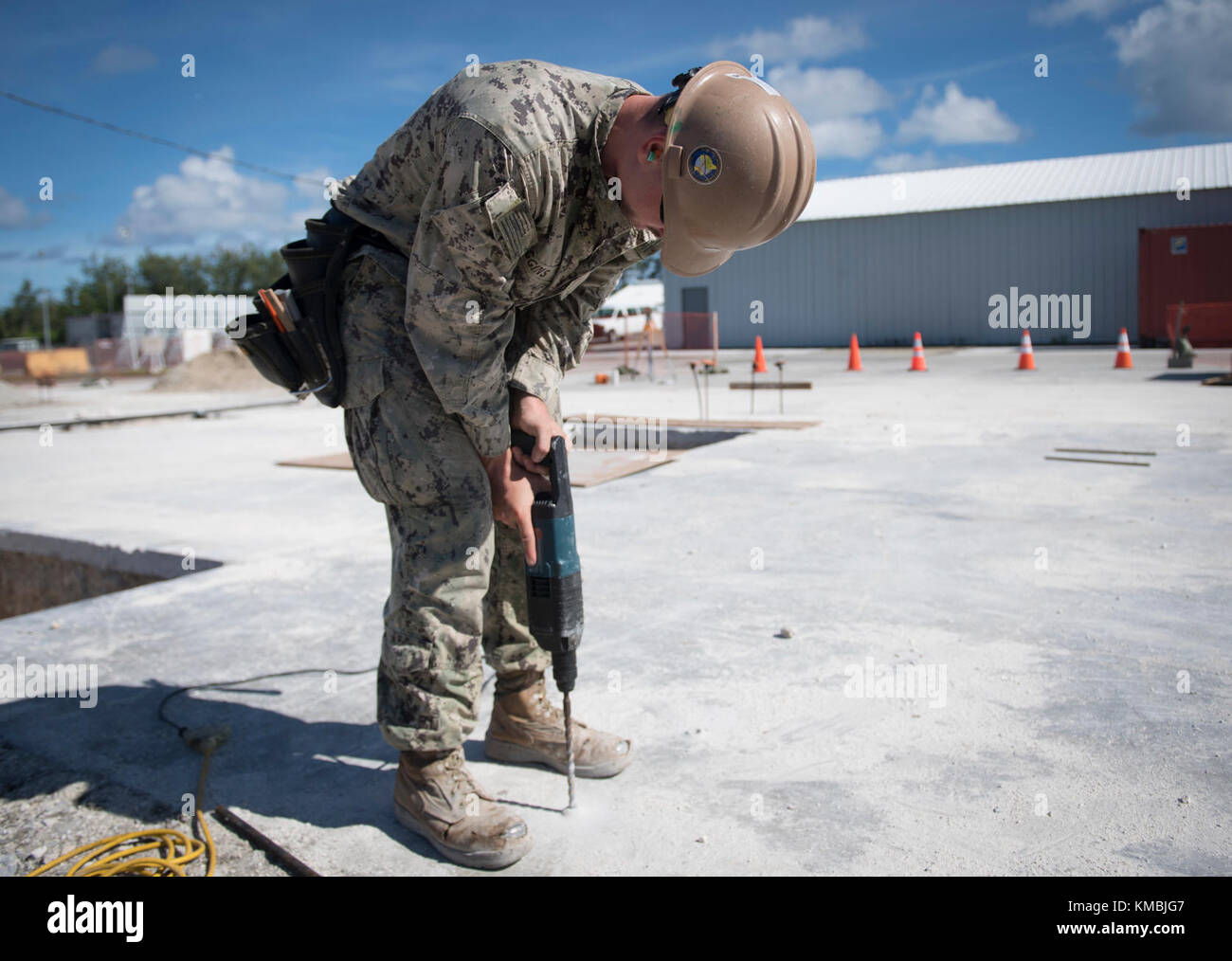 U.S. Navy Builder 3rd Class Christopher Higgins, assigned to Naval ...
