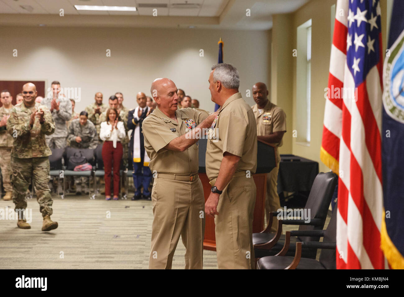 U.S. Southern Command Commander, U.S. Navy Adm. Kurt W. Tidd, adjusts ...