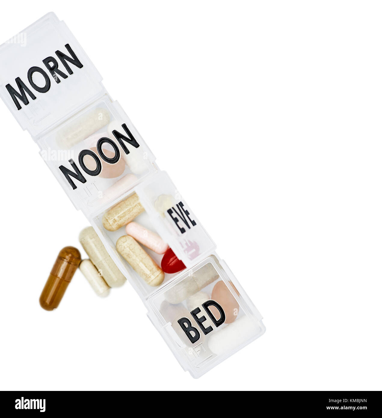 Pill box labeled morn, noon, eve, bed filled with nutritional ...
