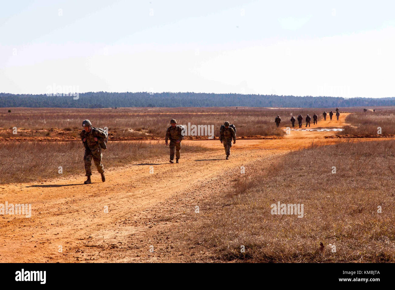 U.S. Army paratroopers walks off Sicily Drop Zone during the 20th ...