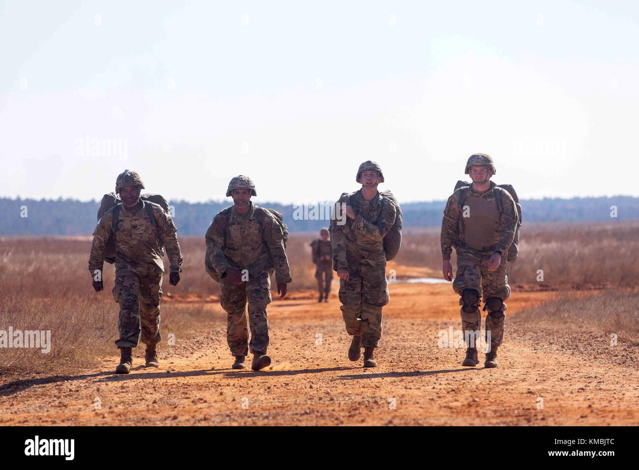U.S. Army paratroopers walks off Sicily Drop Zone during the 20th ...