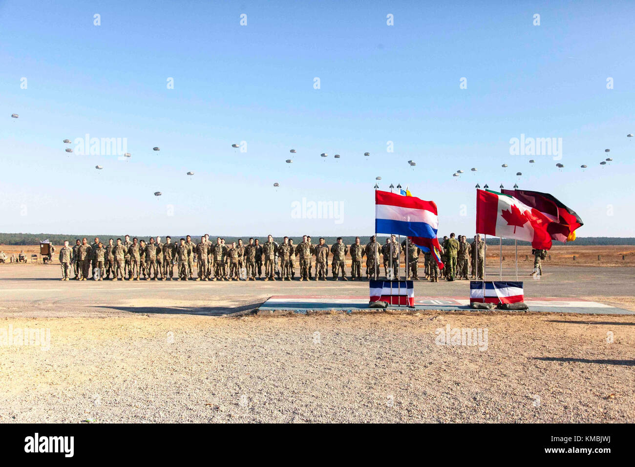 U.S. Army paratroopers stand in formation to receive their Swedish jump ...