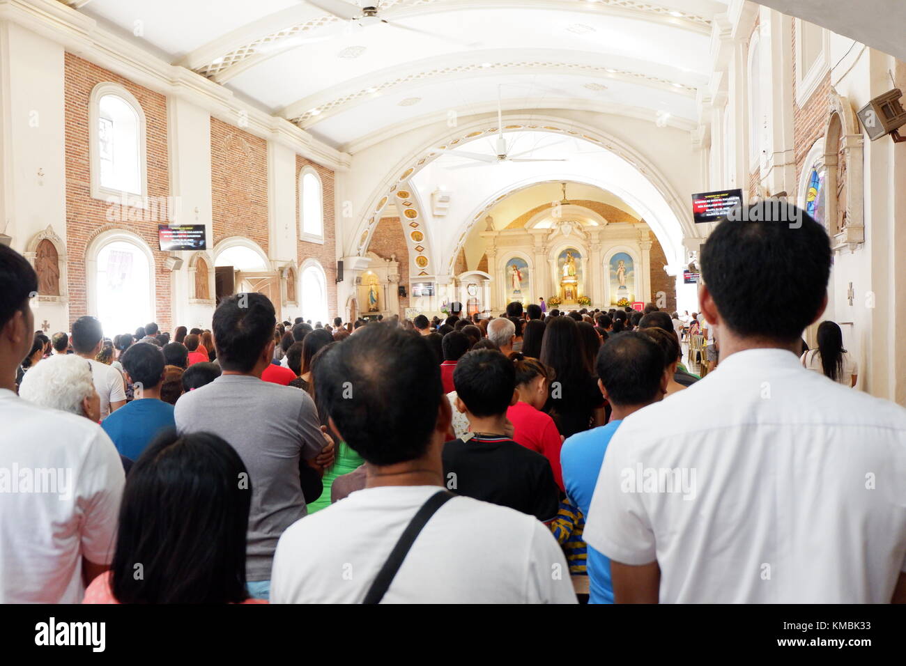 Sunday morning Mass, Captured people standing praising and singing to ...