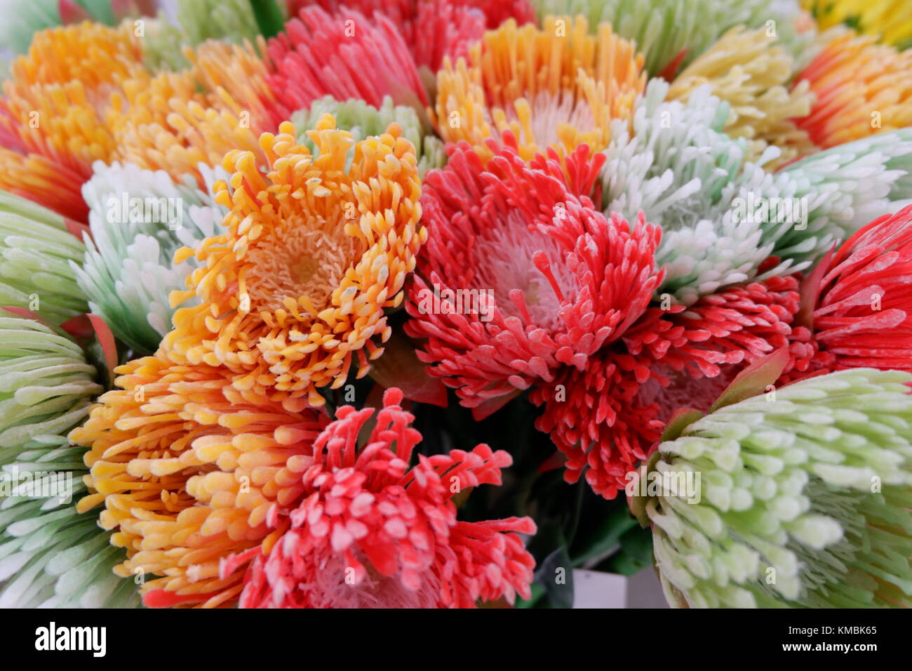 Artificial Colorful Flowers on display looking fresh and real, captured ...