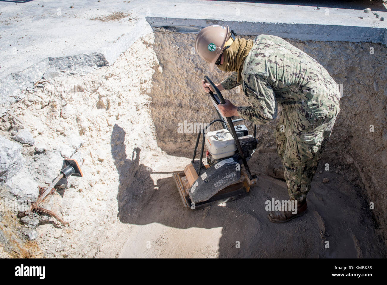 U.S. Navy Builder 3rd Class Christopher Higgins, assigned to Naval ...