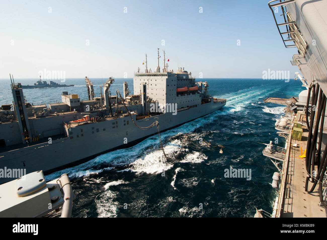 The dry cargo and ammunition ship USNS Alan Shepard (T-AKE 3) deploys a ...