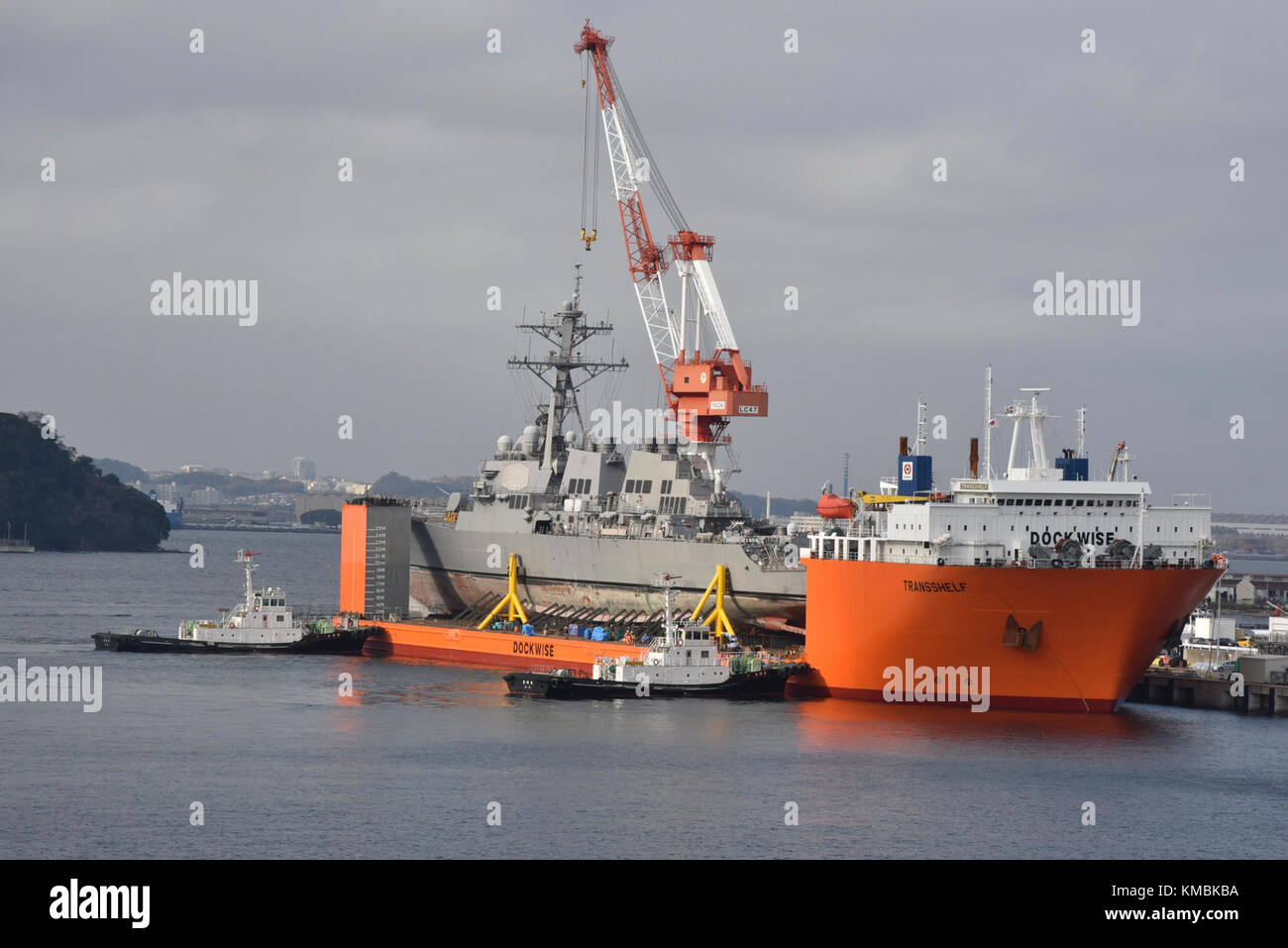 Heavy lift transport dock ship carrying US warship Stock Photo - Alamy