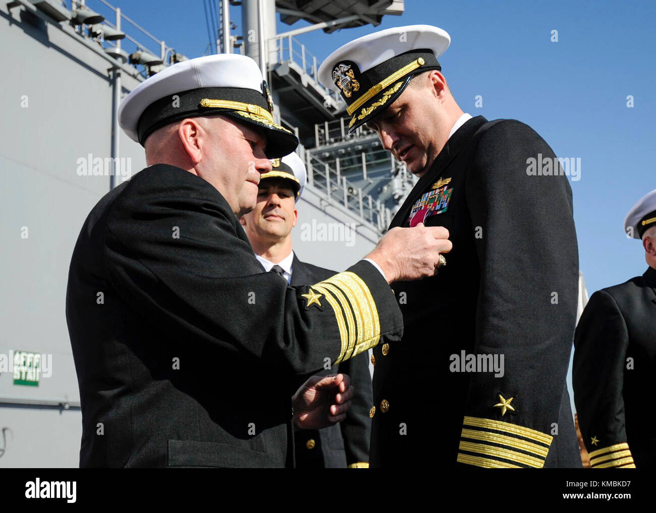 Vice Adm. John D. Alexander, commander of U.S. 3rd Fleet, awards a ...
