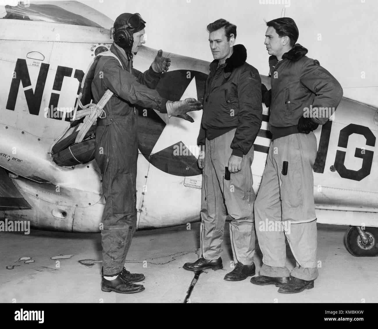 From left to right Lt. George Gorman, Dan Oxley, and Duane Lund discuss ...