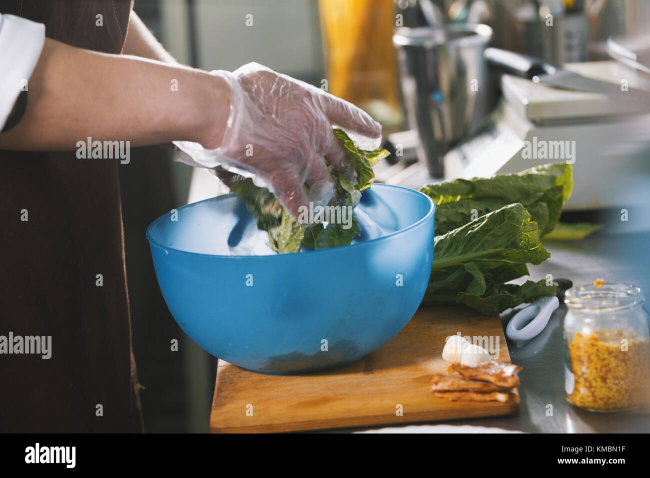 Male chef preparing salad in commercial kitchen Stock Photo - Alamy