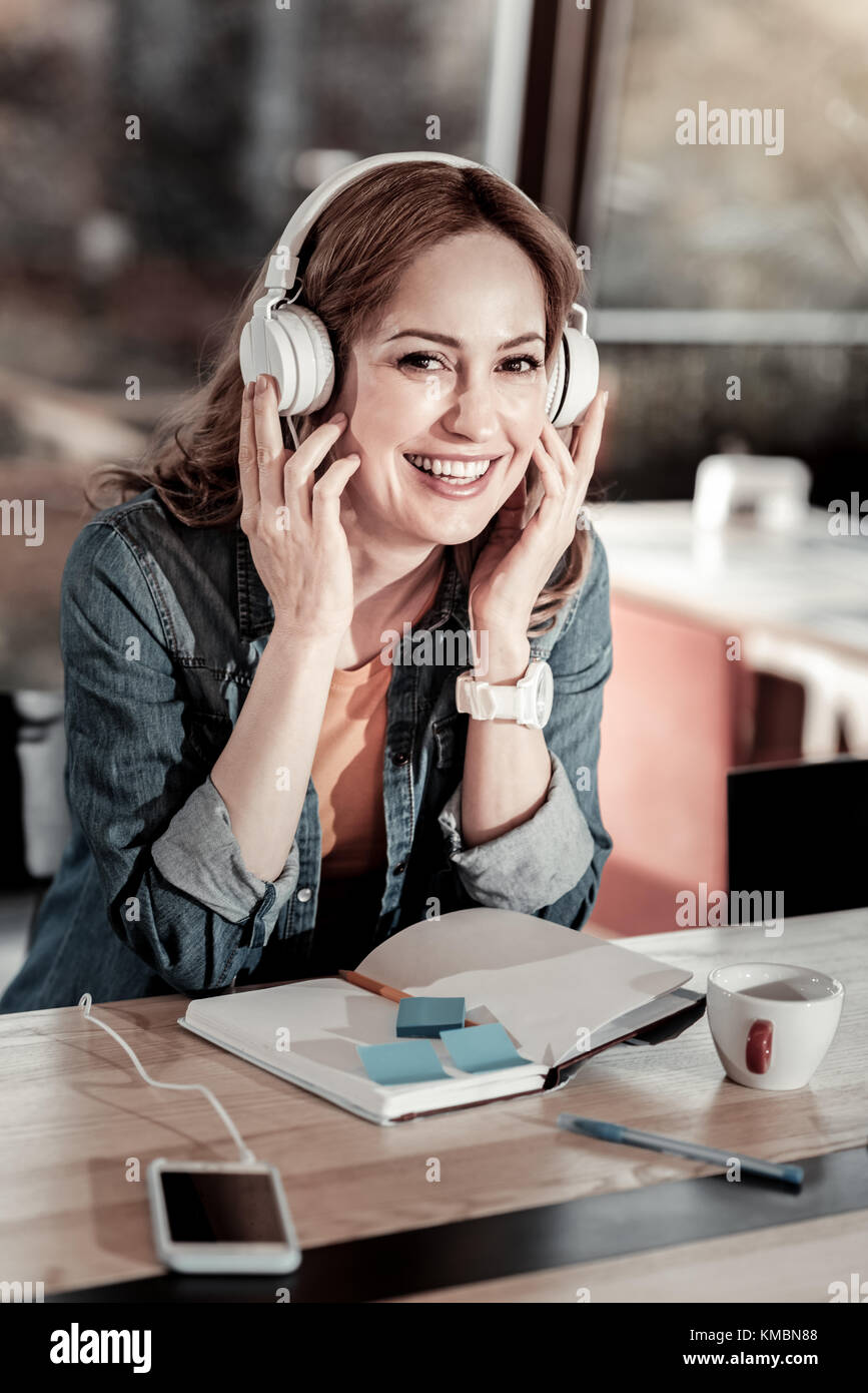 Happy young woman smiling and listening to her favorite music Stock ...