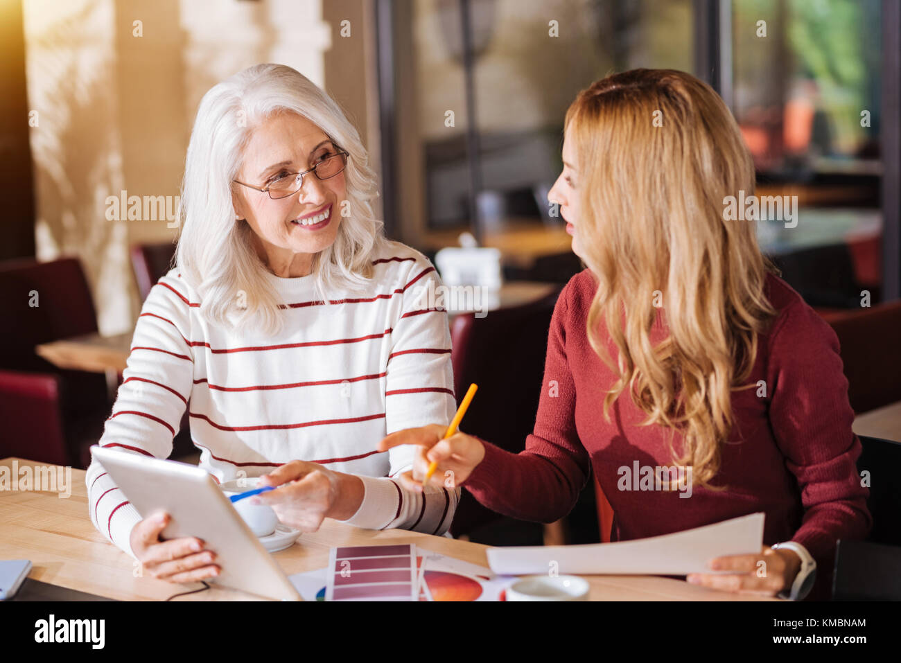 Enthusiastic designers discussing different colors Stock Photo - Alamy