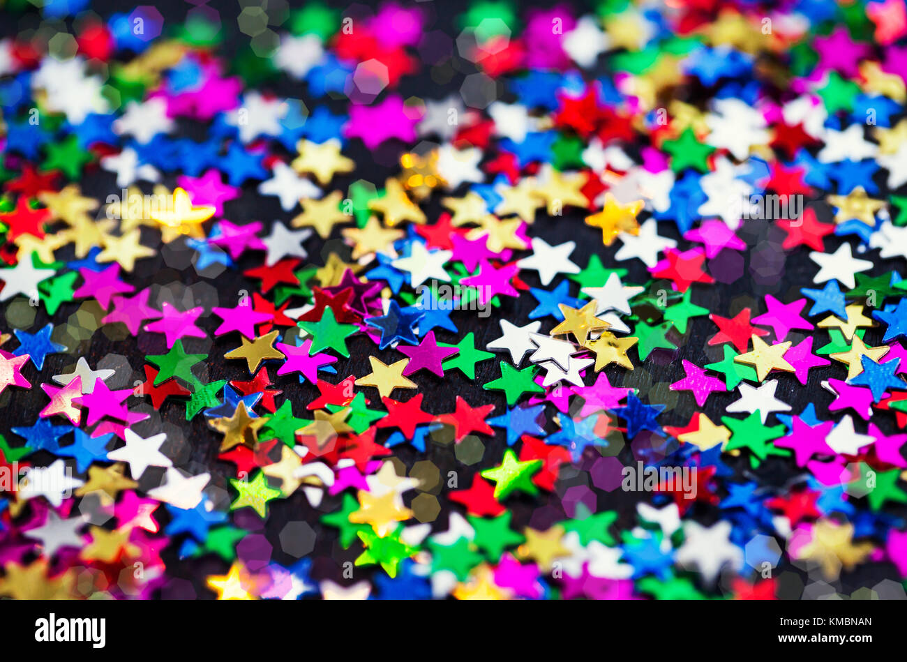 Multicolored holiday stars decoration background Stock Photo - Alamy