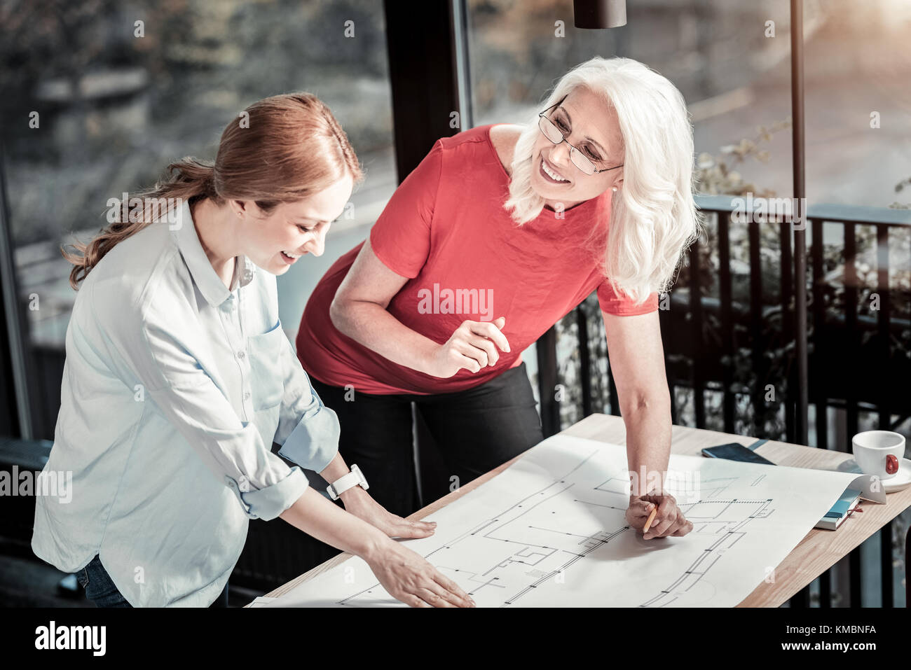 Positive professionals working at the big scheme Stock Photo - Alamy