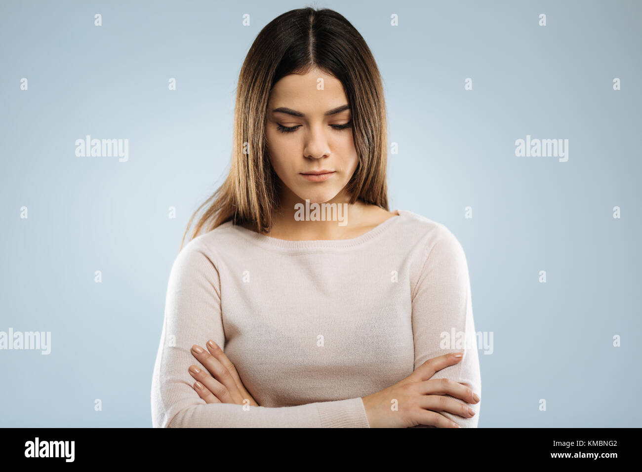 Thoughtful brunette girl looking downwards Stock Photo - Alamy Thoughtful brunette girl looking downwards Stock Photo - Alamy