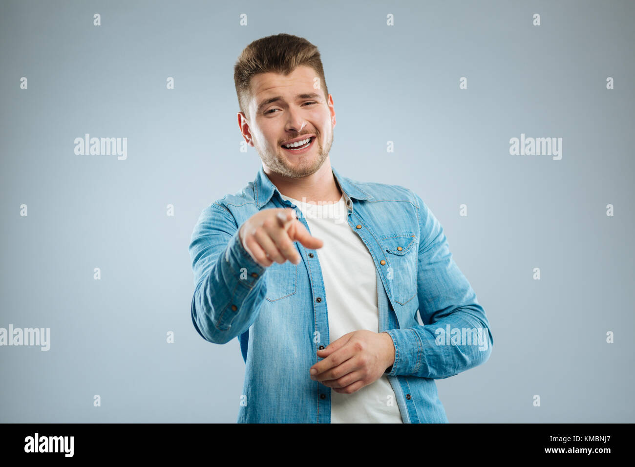 Confident guy pointing at camera Stock Photo - Alamy