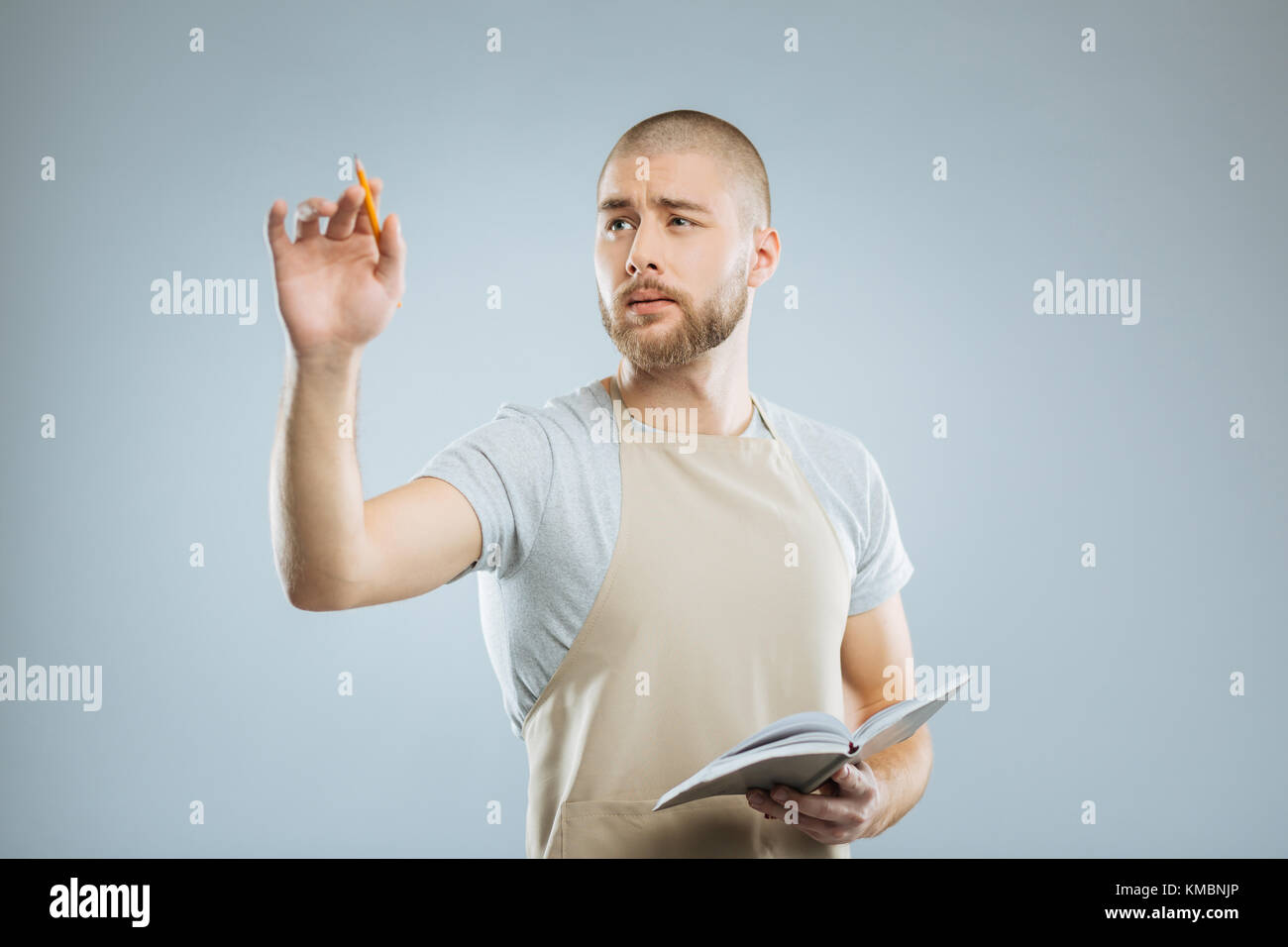 Concentrated man wrinkling his forehead Stock Photo - Alamy