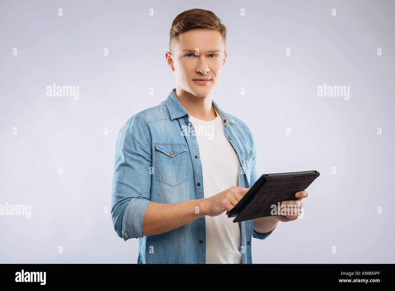 Attentive male person posing on camera Stock Photo - Alamy