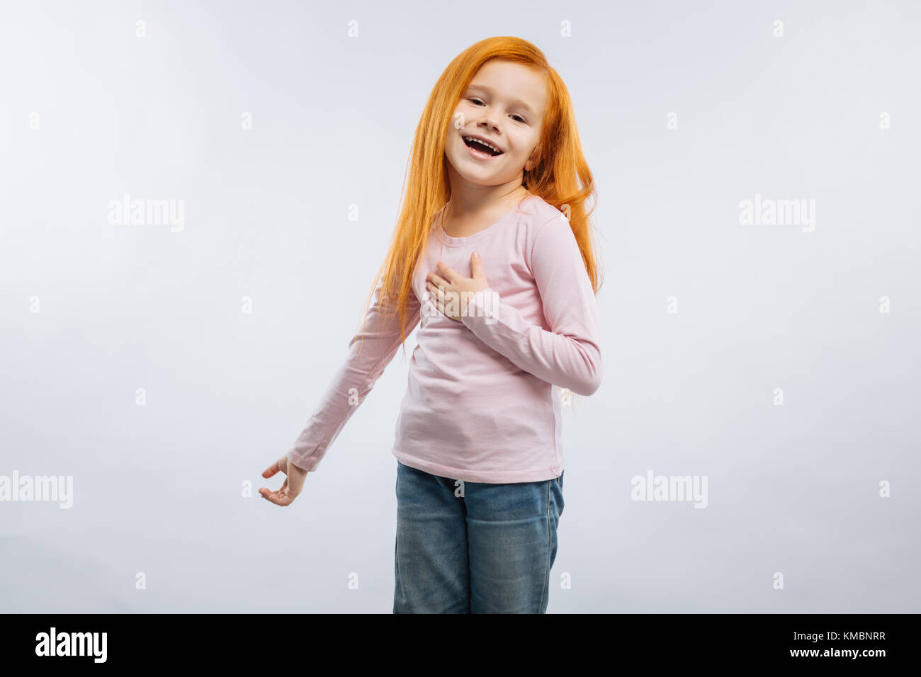 Positive delighted girl looking forward Stock Photo - Alamy