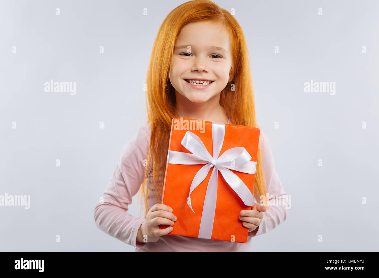 Positive delighted child looking straight at camera Stock Photo - Alamy