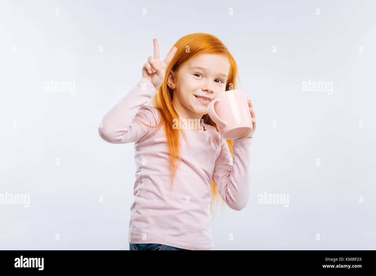 Amazing child showing victory sign Stock Photo - Alamy