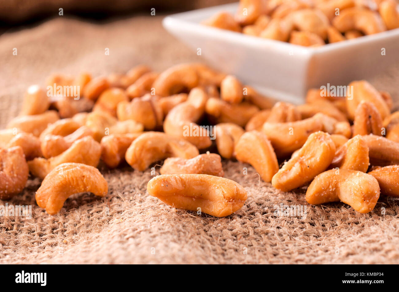 Pile of roasted cashew nuts splashed on the table Stock Photo - Alamy