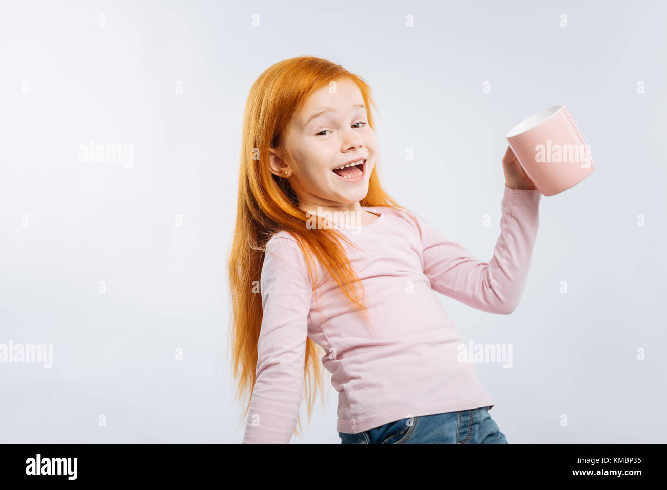 Funny kid making face while posing Stock Photo - Alamy