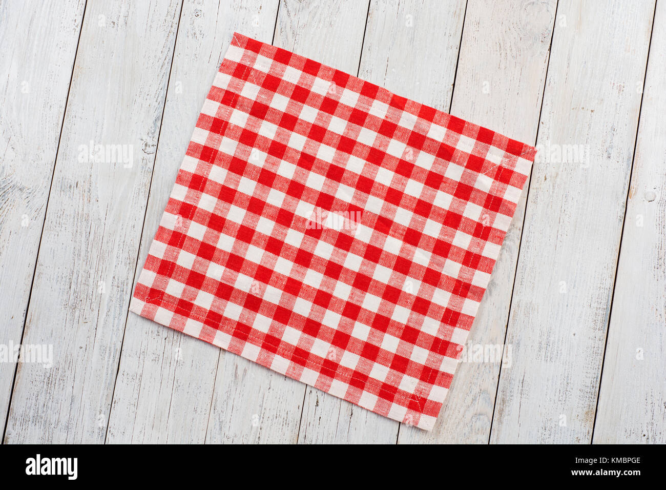 Red tablecloth on white wooden table background Stock Photo - Alamy