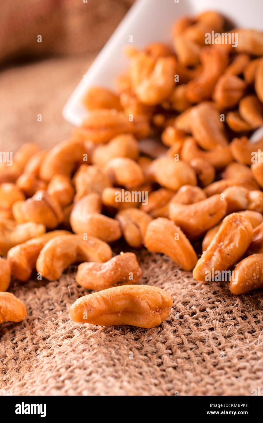 Splashed pile of roasted cashew nuts Stock Photo - Alamy