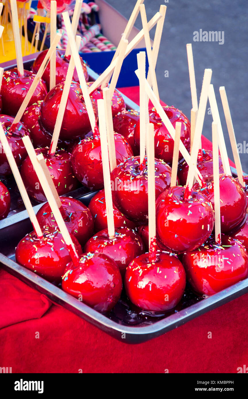 Sweet red apples on the sticks.Selective focus on the front apples ...