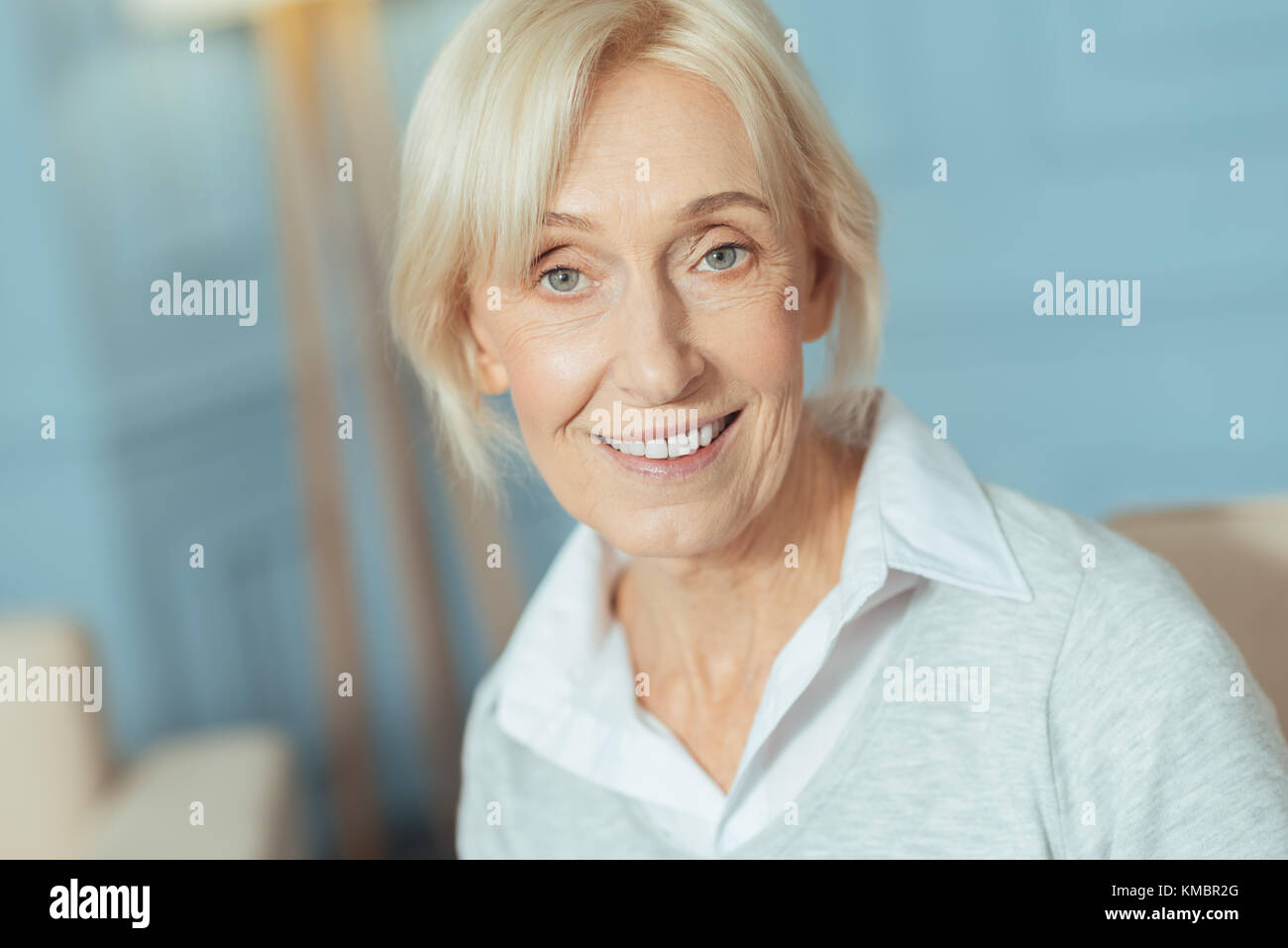Positive happy aged woman feeling happy while smiling Stock Photo - Alamy
