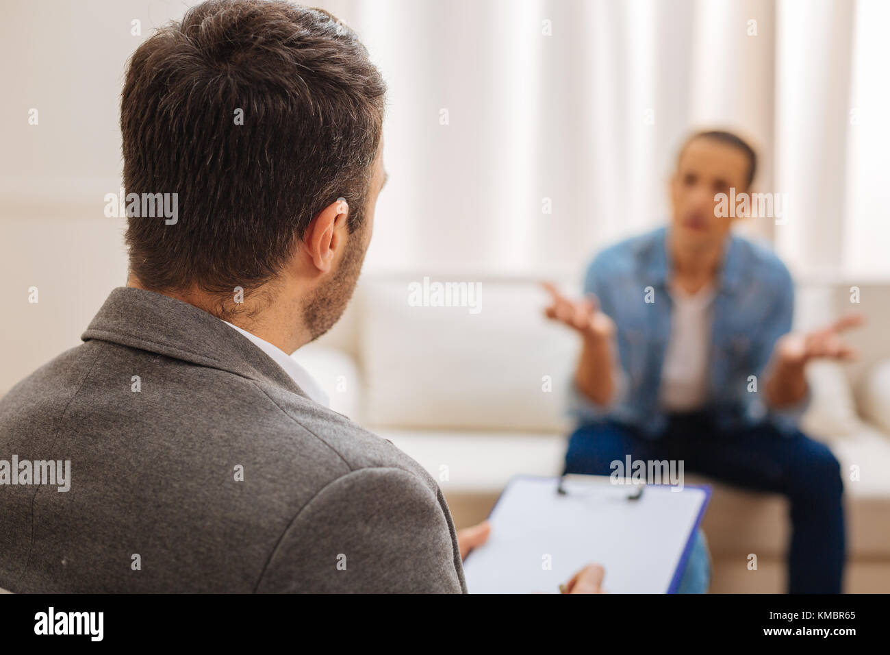 Professional doctor observing severe patients reaction Stock Photo - Alamy
