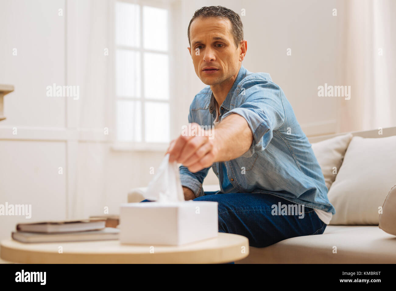 Man crying tissue hi-res stock photography and images - Alamy
