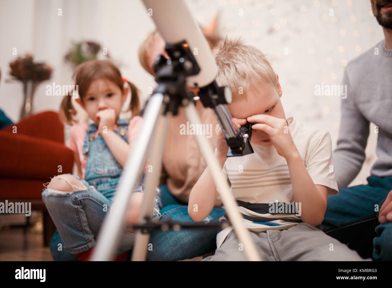 Picture of happy family with telescope Stock Photo - Alamy