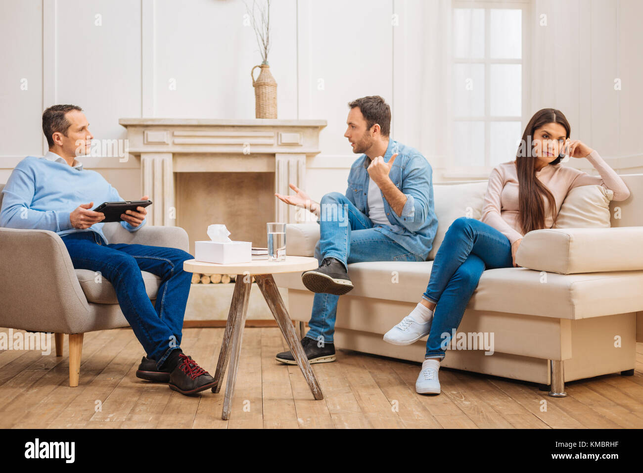 Furious sad man does not understand his wife behavior Stock Photo - Alamy