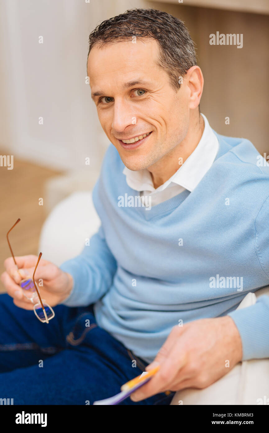 Energetic positive man waiting for answer Stock Photo - Alamy