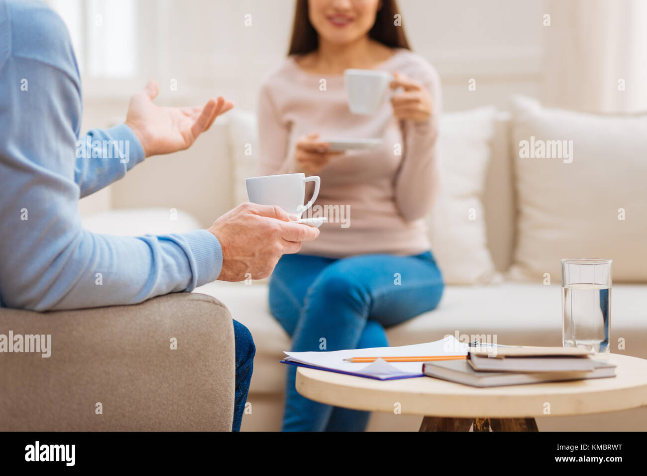 Appealing positive dialog during coffee time Stock Photo - Alamy