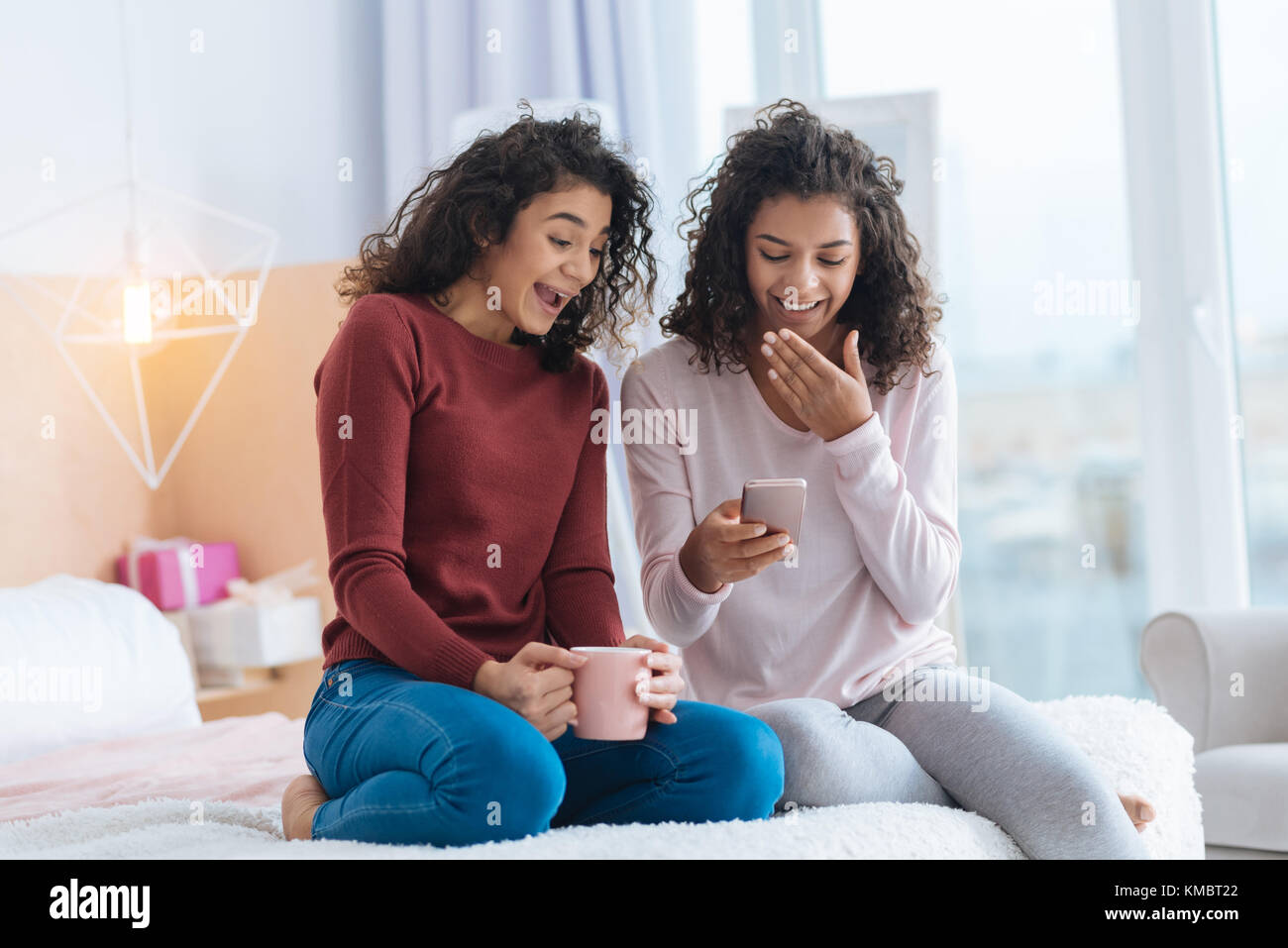 Emotional girl getting excited over boy message Stock Photo - Alamy