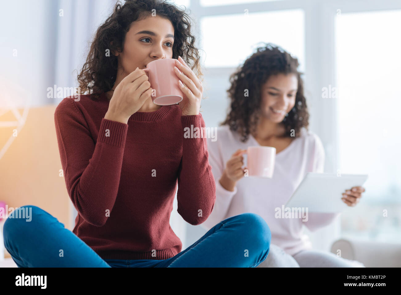Pensive young lady drinking tea and dreaming Stock Photo - Alamy Pensive young lady drinking tea and dreaming Stock Photo - Alamy