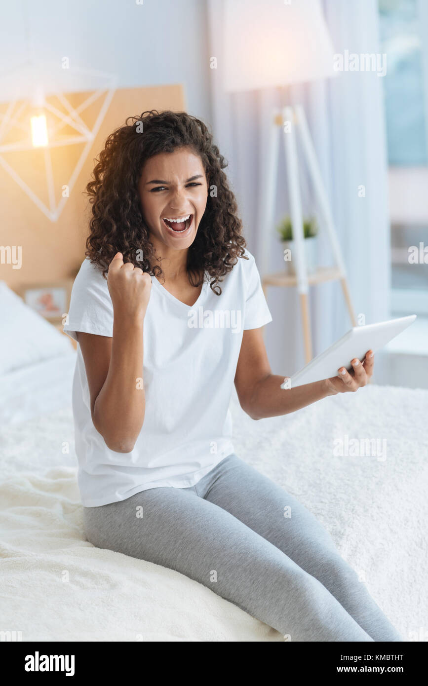 Extremely happy girl celebrating her success Stock Photo - Alamy