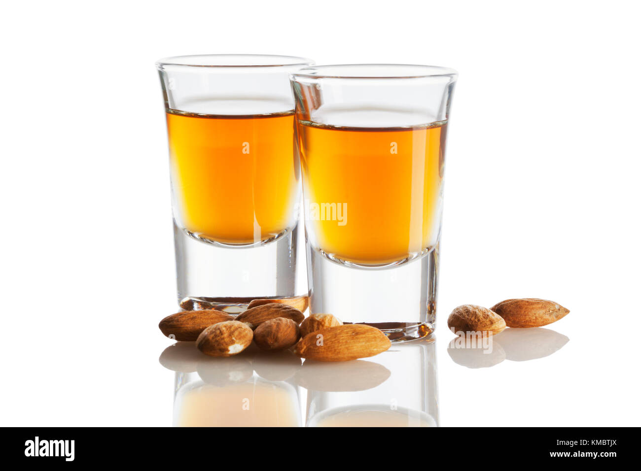 Italian Amaretto liquor and almonds isolated on white Stock Photo - Alamy