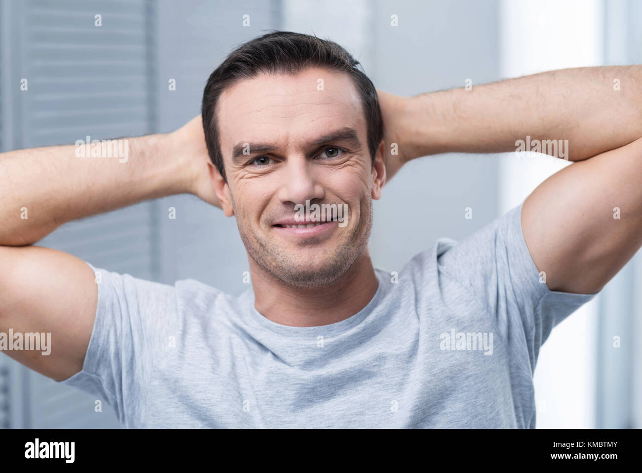 Handsome positive man beaming confidence Stock Photo - Alamy