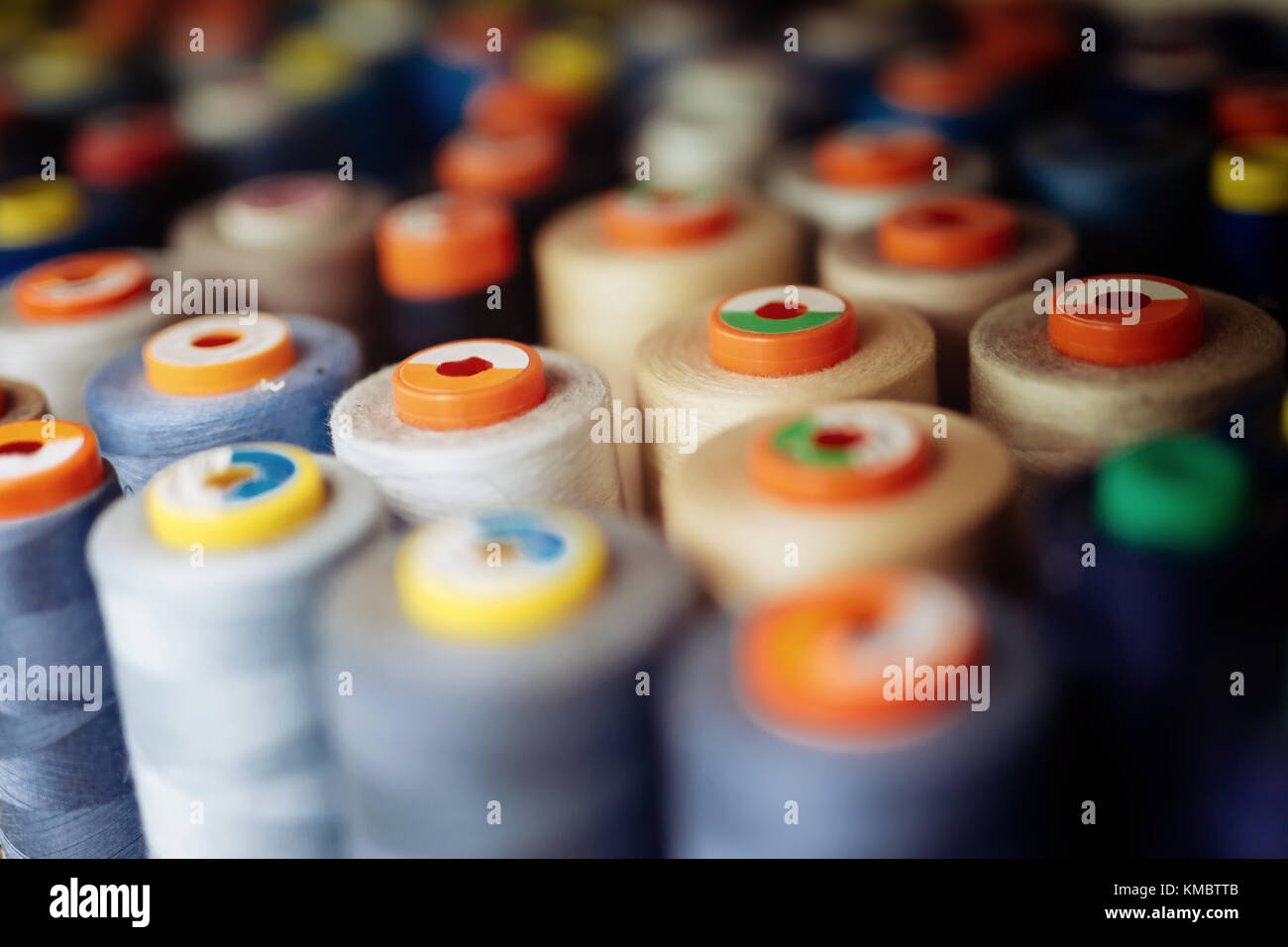 Thread spools in fabric industry Stock Photo - Alamy