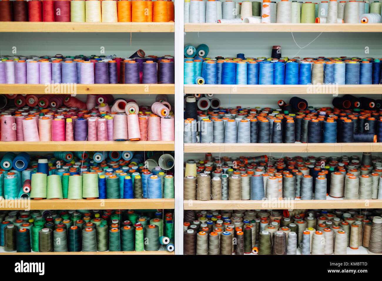 Colorful thread spools used in fabric industry Stock Photo - Alamy