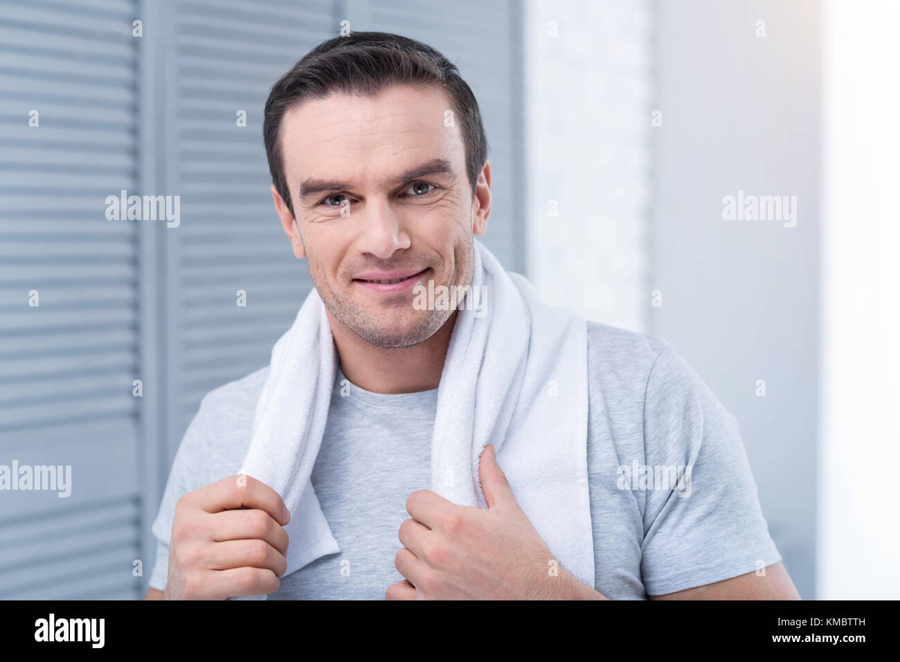 Joyful positive man existing after training Stock Photo - Alamy