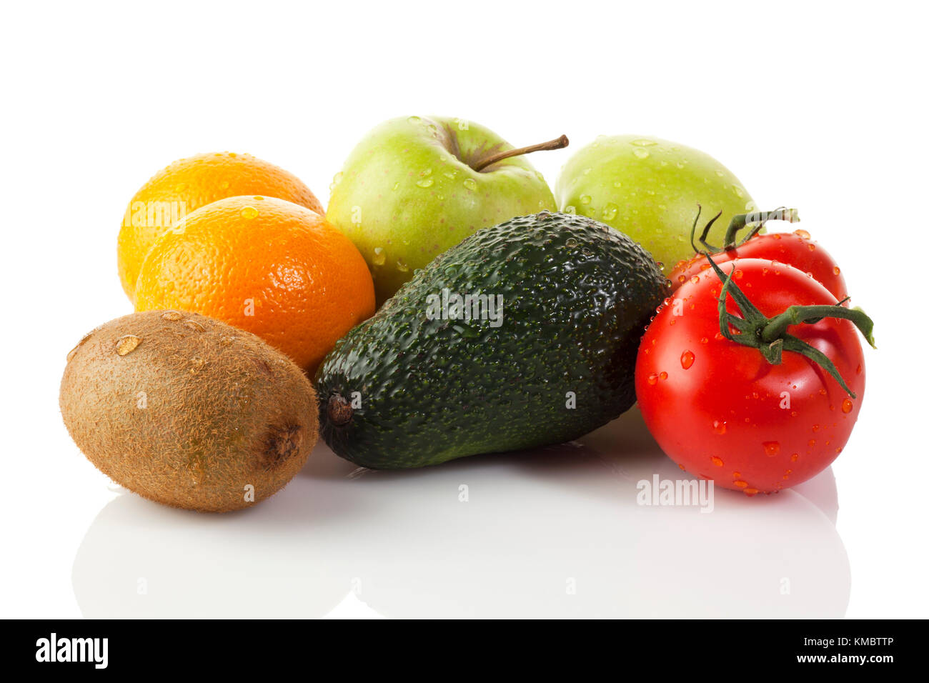 Variety of fresh fruit with water drops isolated on white background ...