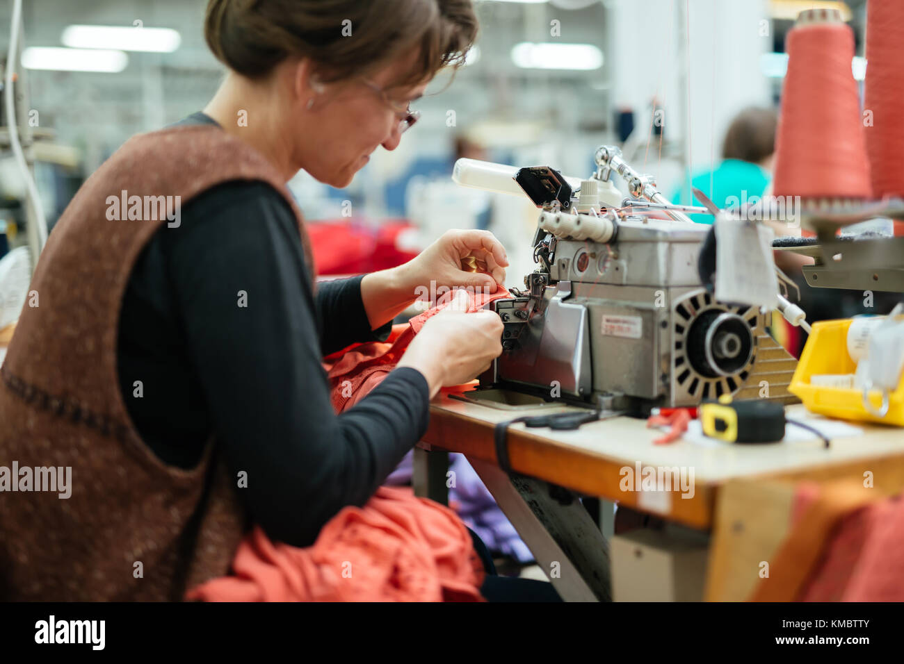 Woman Working In Textile Factory High Resolution Stock Photography and ...