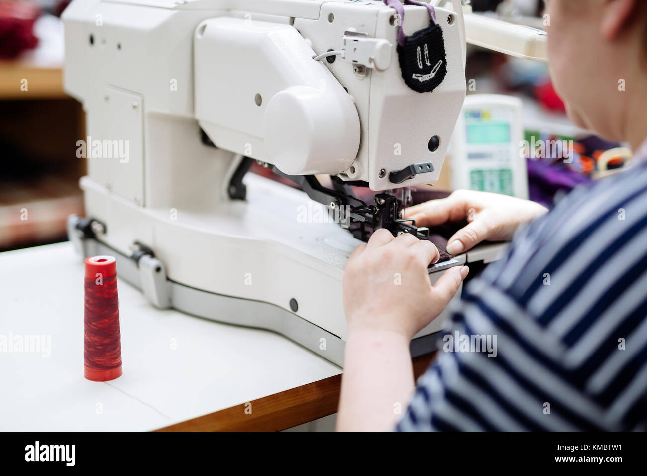 Woman working in textile industry Stock Photo - Alamy