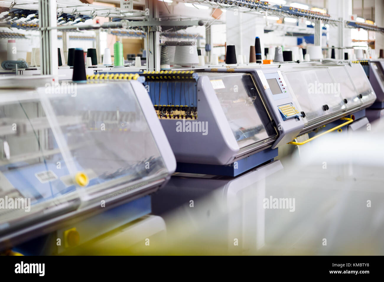 Computerized knitting machines Stock Photo - Alamy