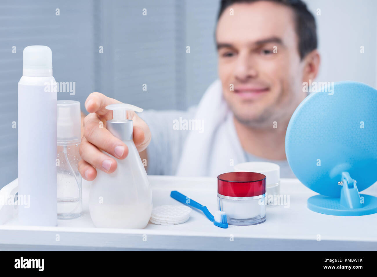 Putting lotion hi-res stock photography and images - Alamy